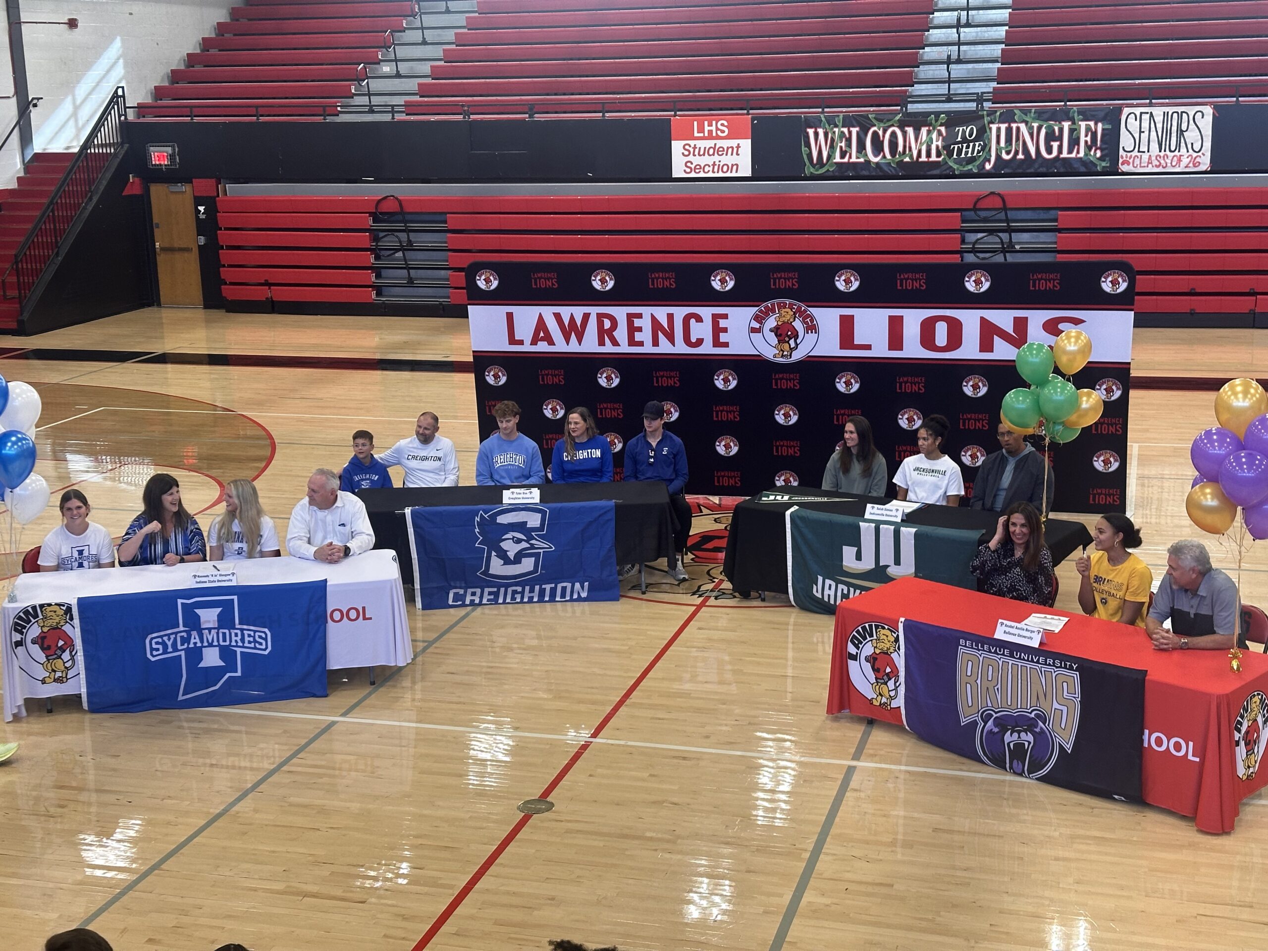 Lawrence celebrates signing day for three volleyball players and track ...